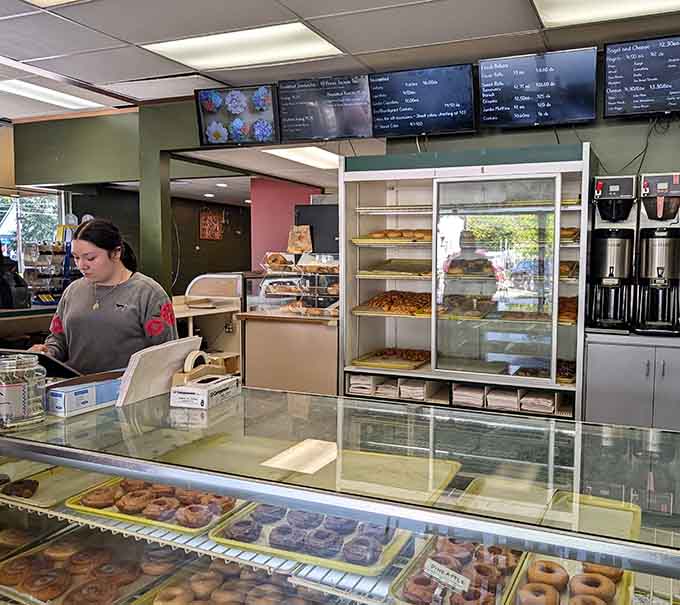 Behind this counter, magic happens daily as fresh doughnuts and bagels emerge to brighten your morning routine.