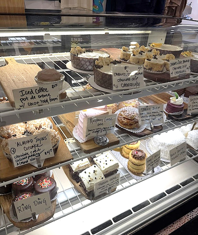 The dessert case presents life's most beautiful dilemma: which of these handcrafted treasures deserves to accompany your coffee today?