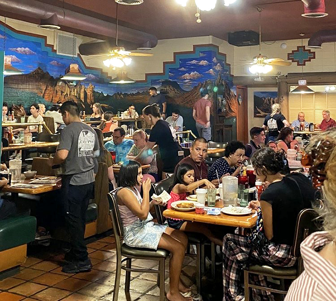Where memories are made &ndash; families and friends gather in this bustling dining room against a backdrop of stunning desert murals.