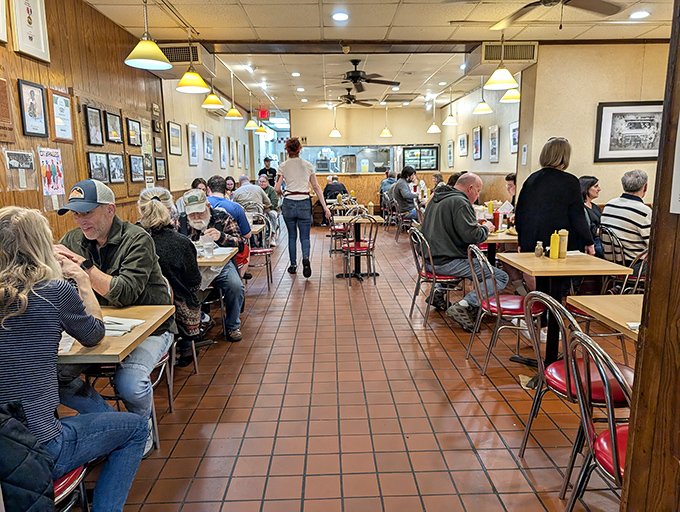 The bustling interior where generations gather &ndash; a living tapestry of St. Paul life unfolding over sandwiches taller than some toddlers.