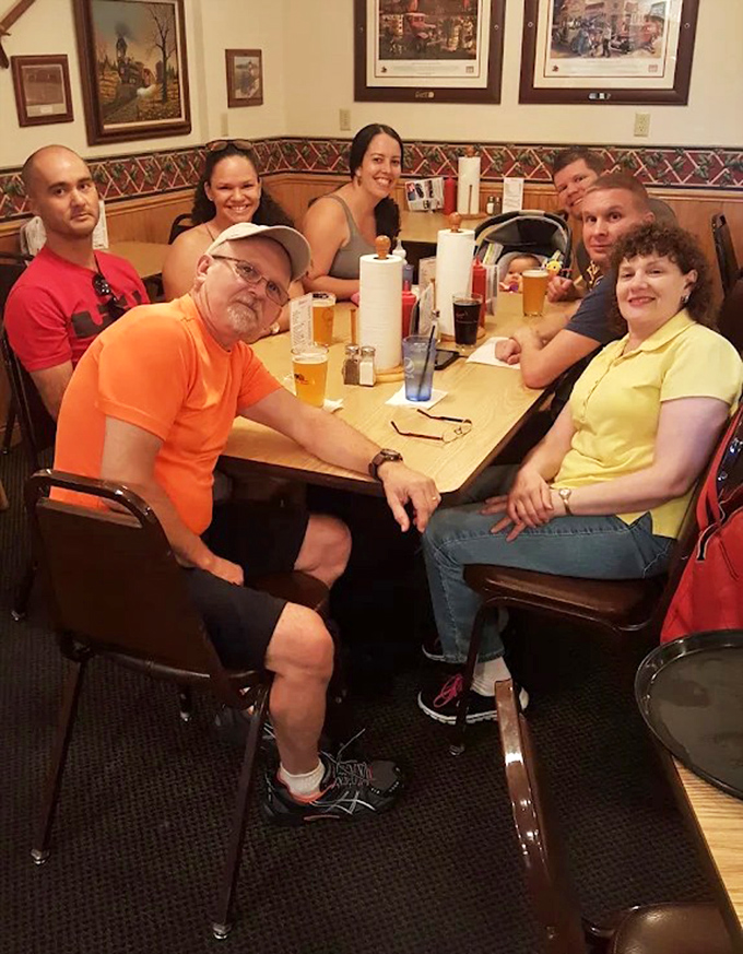 Happy diners gathered around a table &ndash; the true measure of any restaurant's success isn't awards, but the joy it brings to its customers.