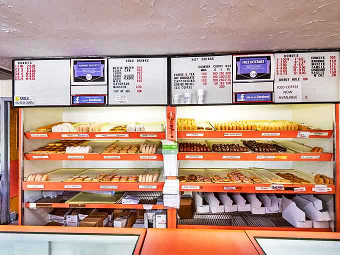 Behind this counter lies everything you need for happiness, assuming your definition of happiness involves fresh donuts and it absolutely should.