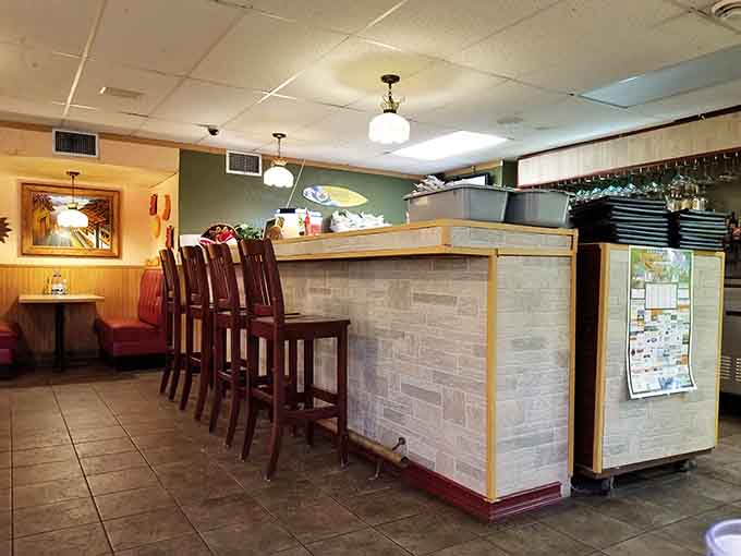 Counter seating offers front-row seats to the restaurant's rhythm, perfect for solo diners or quick visits.
