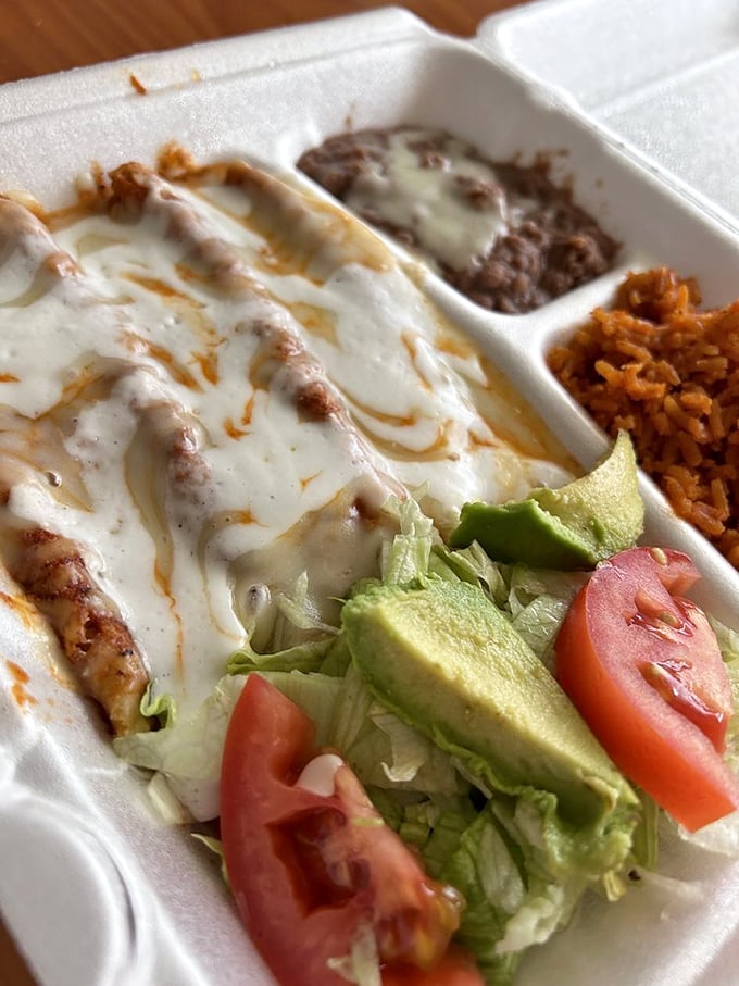 Enchiladas that could make a grown person weep with joy. Smothered in sauce, loaded with cheese&mdash;it's comfort food that gives you a warm, spicy hug.