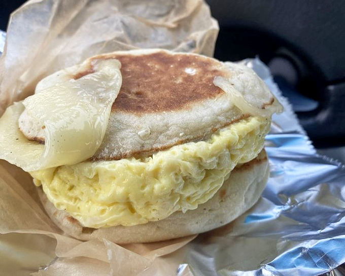 Breakfast sandwich perfection &ndash; homemade English muffins cradle farm-fresh eggs and cheese in a handheld morning masterpiece.