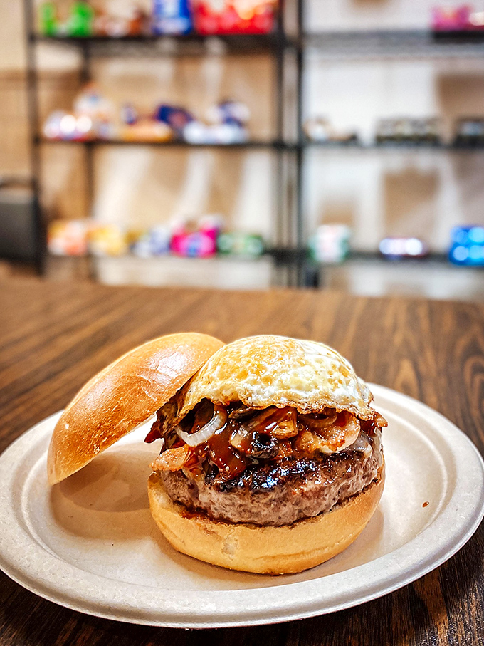 The Firehouse Burger stands tall and proud, topped with a perfectly fried egg &ndash; a multicultural masterpiece that bridges the Atlantic with every bite.
