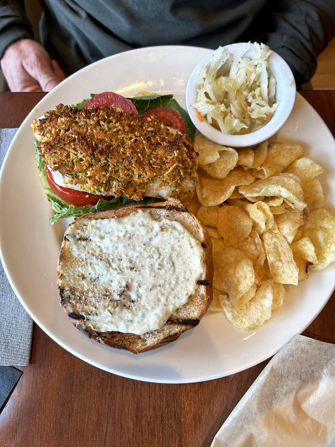 Holy mackerel! This fish sandwich is the catch of the day, nestled in a bun so perfectly toasted, it deserves its own sunscreen.