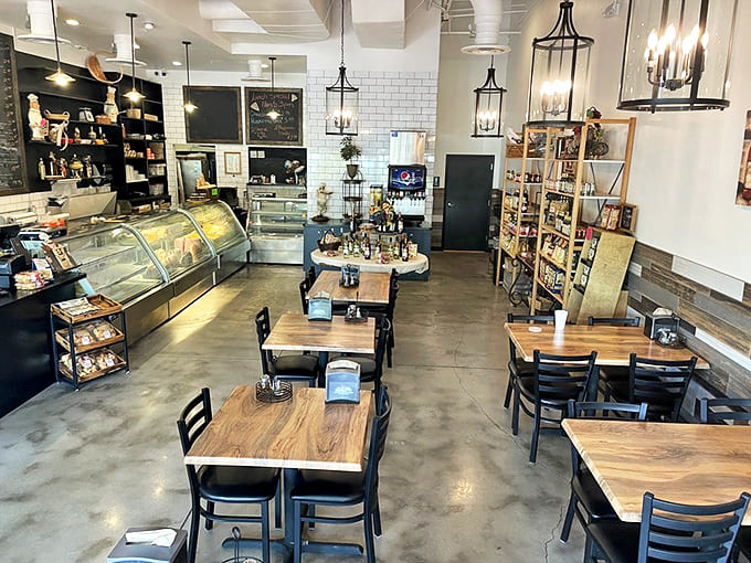 The dining area balances casual comfort with rustic charm – wooden tables, industrial lighting, and an atmosphere that invites you to linger.