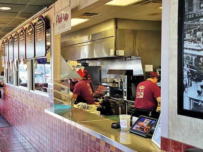 Where the magic happens &ndash; skilled hands work with practiced efficiency behind the counter, transforming simple ingredients into legendary Chicago fare.