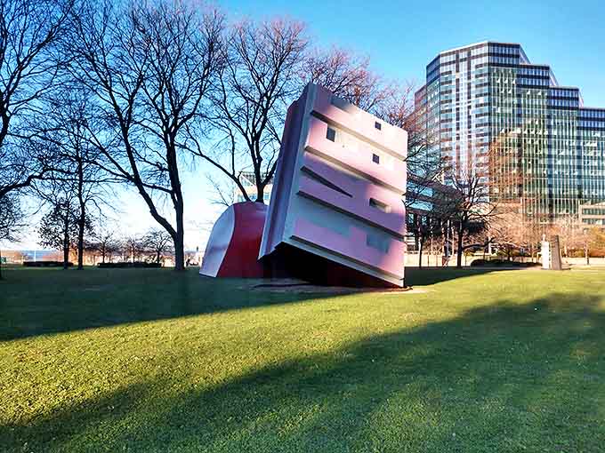 Long shadows stretch from the Free Stamp across Willard Park, creating an artistic extension of this already impressive sculpture.