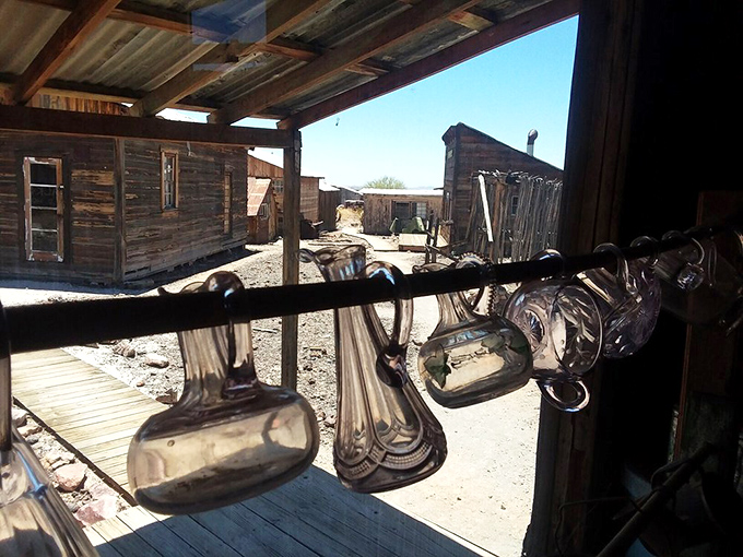 Sunlight dances through antique glass, each bottle and jar holding stories of medicine, libations, and daily necessities.