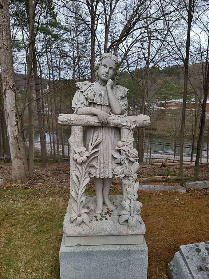 This young girl's monument captures childhood innocence frozen in stone, a poignant reminder that cemeteries hold stories of lives both long and heartbreakingly brief.
