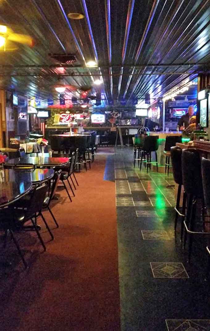 The long view down the bar reveals a playground for adults, where pool tables and neon signs promise entertainment between bites.