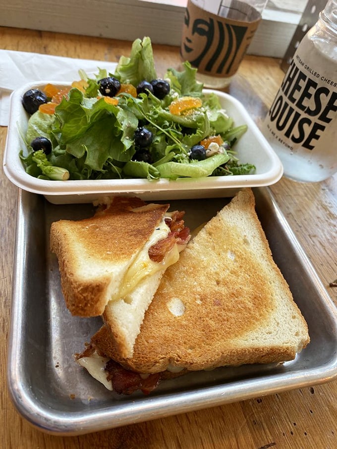 The perfect balance: a gooey grilled cheese with a fresh, crisp salad. It's like having your cake and eating it too, but cheesier.