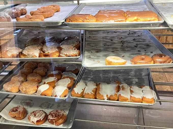 The display cases showcase row after row of fresh-baked goods, each one practically begging you to take it home immediately.