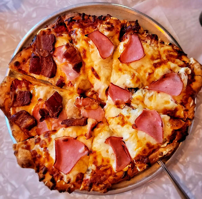 Hawaiian pizza done right with ham and a generous cheese blanket proves that pineapple absolutely belongs on pizza, fight me.