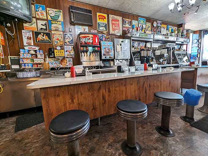 The classic diner counter with chrome stools offers front-row seats to the breakfast show, perfect for solo diners and people-watchers alike.
