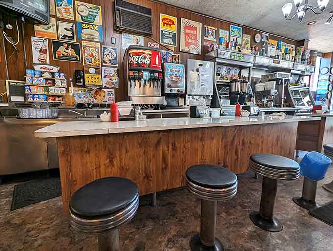 Classic diner counter seating where solo diners and coffee enthusiasts can watch the breakfast magic happen.