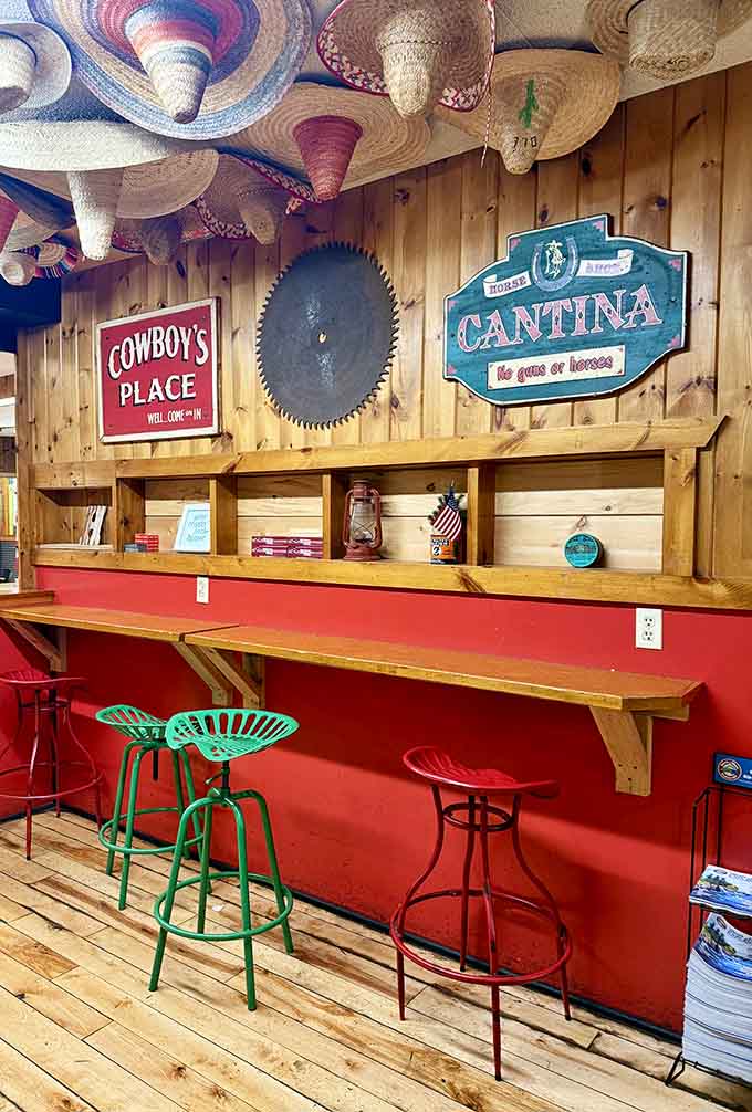 Counter seating with colorful tractor stools and sombreros overhead creates the perfect spot for solo diners or small groups.