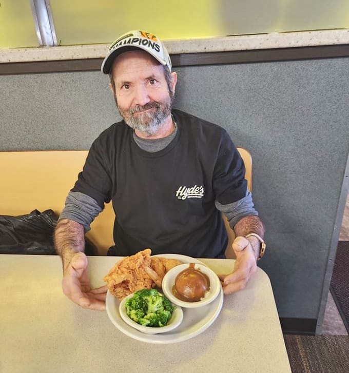 Happy diner enjoying plates that prove portion sizes haven't forgotten what generous means, unlike most modern restaurants these days.
