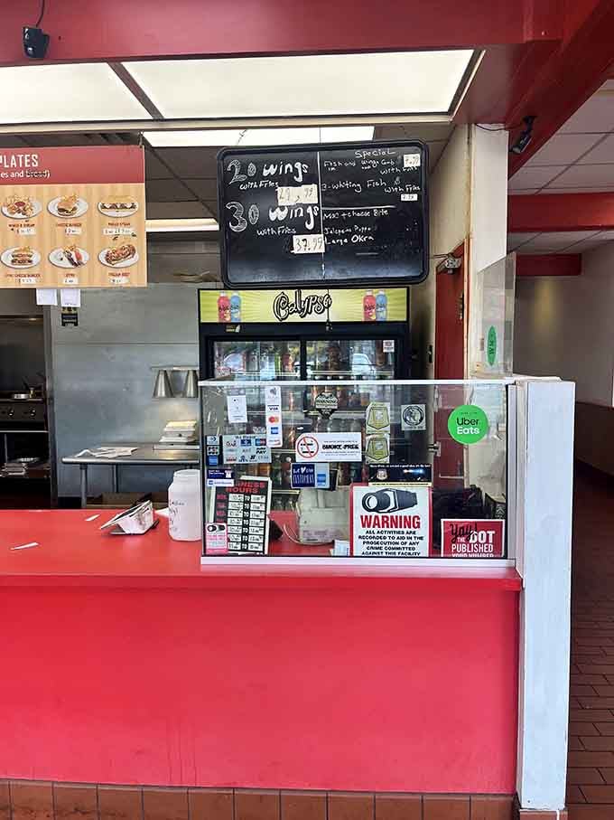 The counter where magic happens, orders fly, and hungry customers watch their meals come together with practiced efficiency and care.