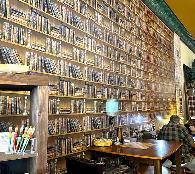 A wall of book spines creates the perfect backdrop for pretending you're in a cozy library that serves excellent lattes.