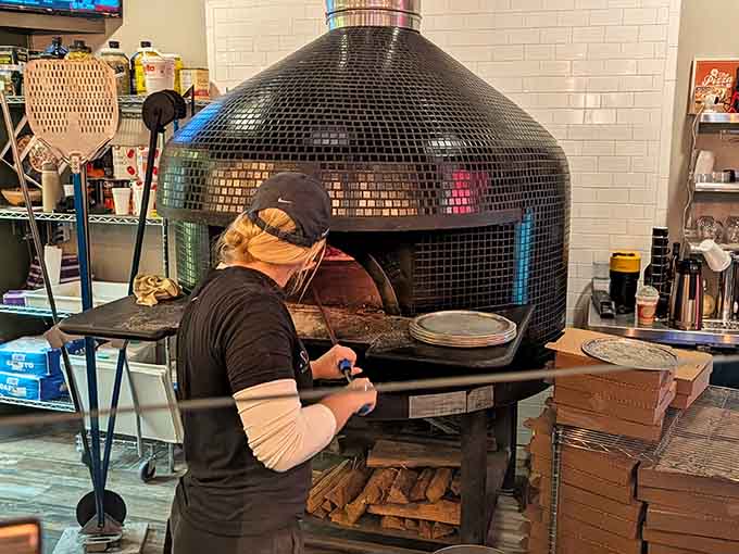 That wood-fired oven working at 900 degrees is where the magic happens, turning simple ingredients into crispy, bubbly, charred perfection.