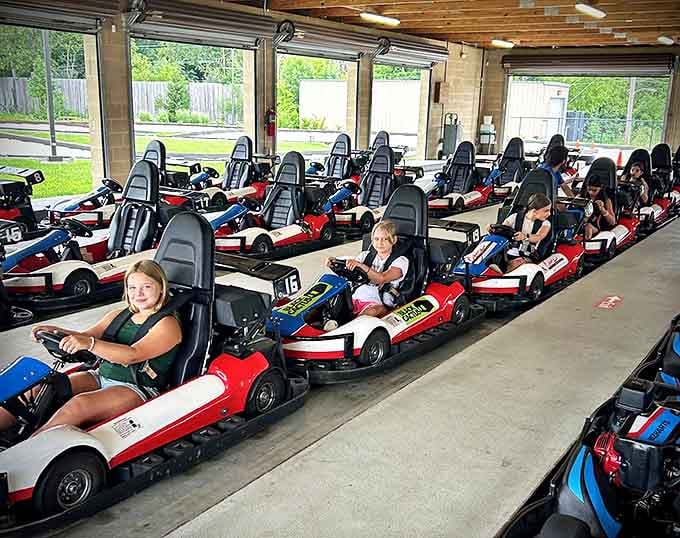 Young racers prepare for their adventure, their expressions a delightful mix of excitement and serious racing business.