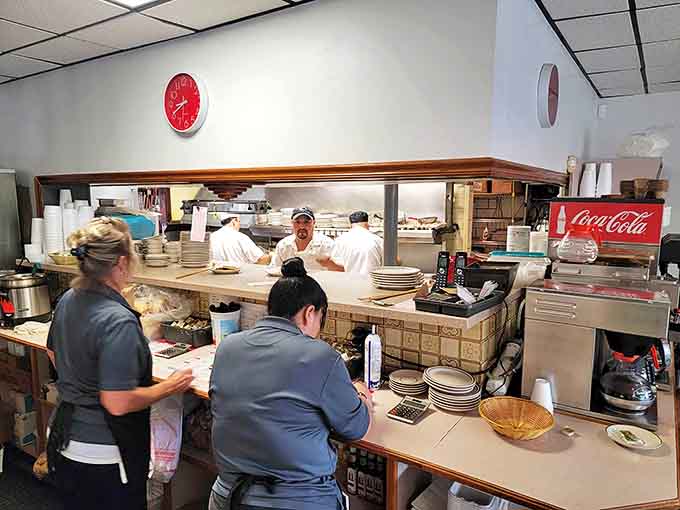 Behind the kitchen window, Ray's cooks orchestrate the breakfast ballet with practiced precision and zero unnecessary flourishes.