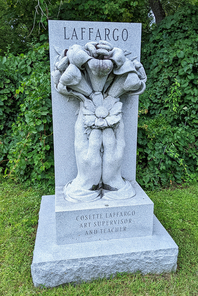 The Laffargo monument features a bouquet of roses so perfectly rendered in stone that visitors are tempted to touch them to confirm they're granite.