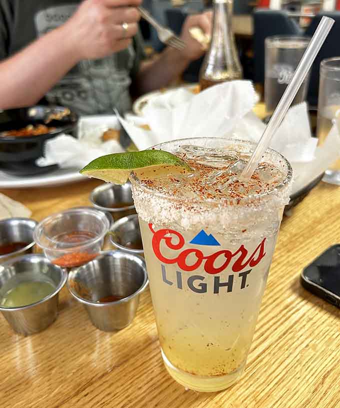 Even the beverages get special treatment, with this perfectly prepared margarita featuring a proper salt rim and fresh lime garnish.