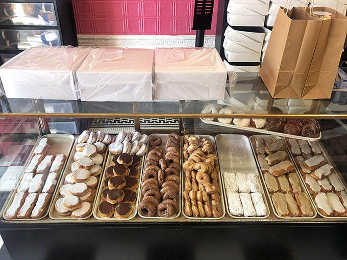 The display cases stay remarkably full despite constant customer traffic, a testament to the bakery's impressive production capabilities and your future waistline.