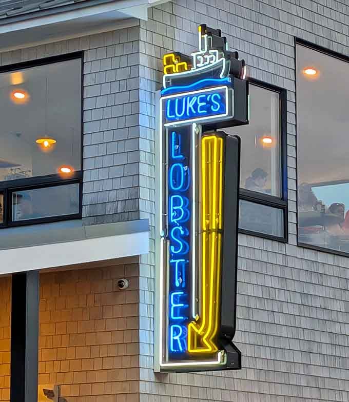 That retro vertical sign with the little boat on top is basically a beacon calling all seafood lovers home to happiness.