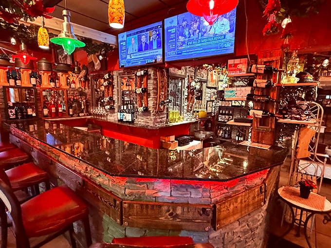 The bar area gleams with promise, that curved stone counter and wall of bottles inviting you to settle in and stay awhile.