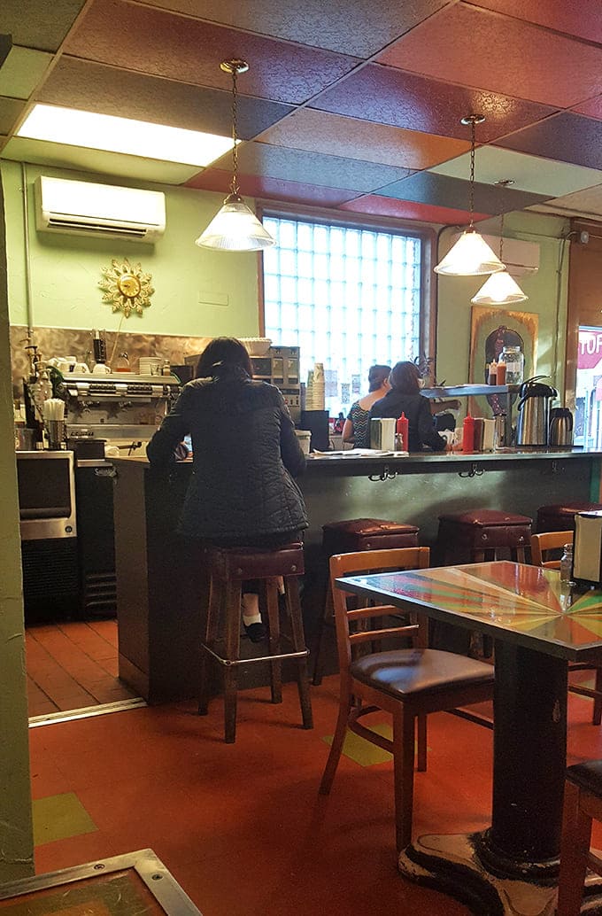 The service counter is command central for breakfast magic, where skilled hands transform simple ingredients into morning masterpieces worth waiting for.