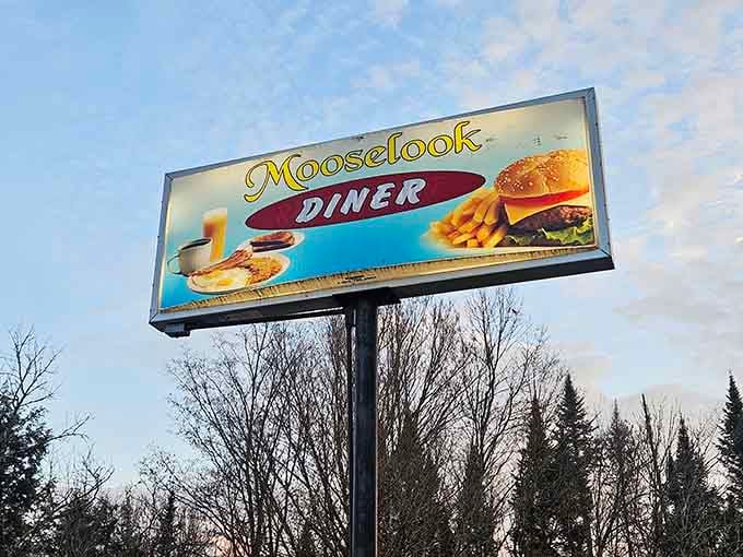 The roadside sign beckons travelers like a lighthouse guiding ships, promising pancake salvation to all who enter.