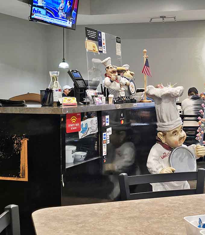 The counter area showcases whimsical chef figurines standing guard &ndash; silent sentinels overseeing the breakfast operation with permanent smiles.