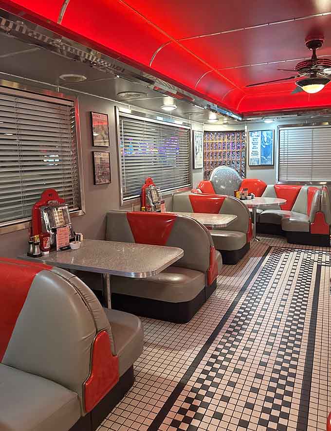 The cozy booth seating with red accents invites you to slide in, relax, and forget about the outside world for a while.