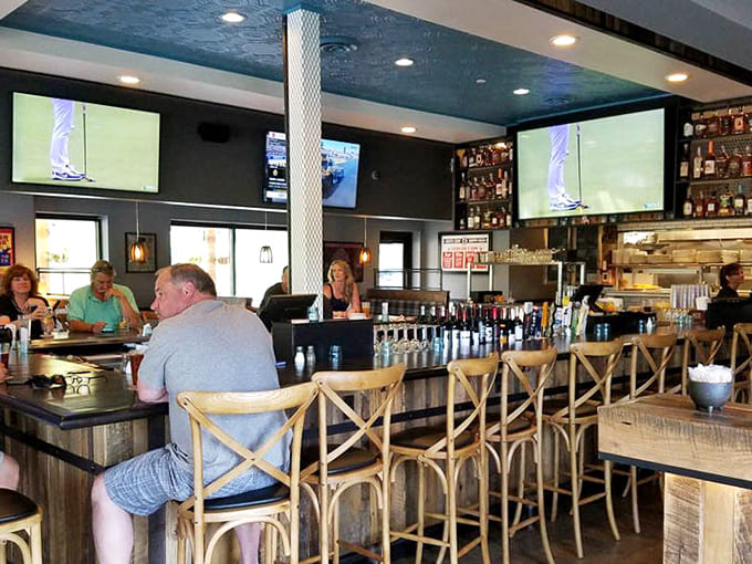 The well-stocked bar beckons with craft beers and cocktails, multiple screens for game day, and bartenders who know their stuff.