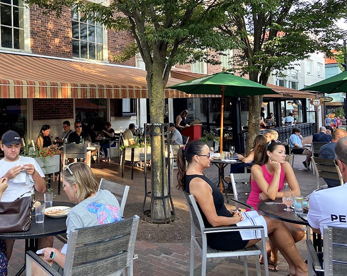 Happy diners enjoying outdoor seating prove that good food tastes even better with fresh air and sunshine.