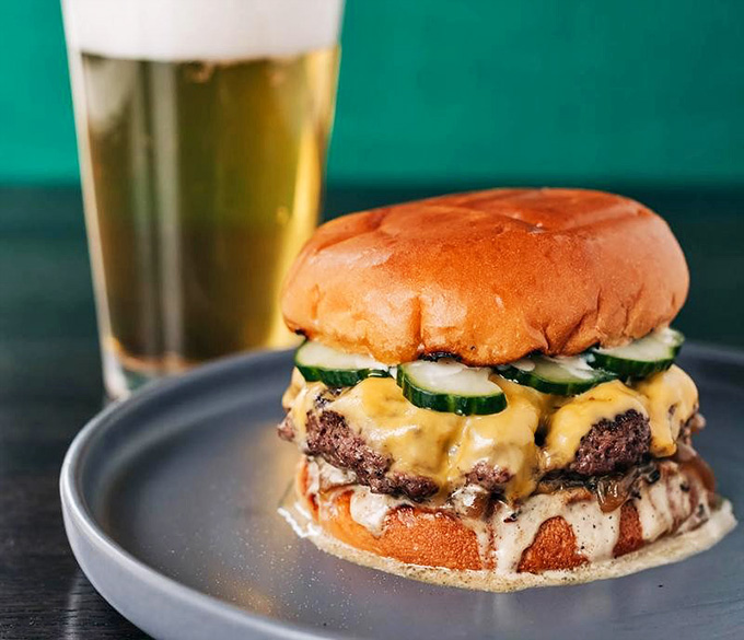 That burger oozes with enough cheese and confidence to make you forget you were supposed to be eating healthy.