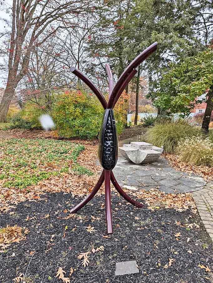 Curved forms create an elegant conversation in metal, their lines flowing like water frozen in an eternal moment.