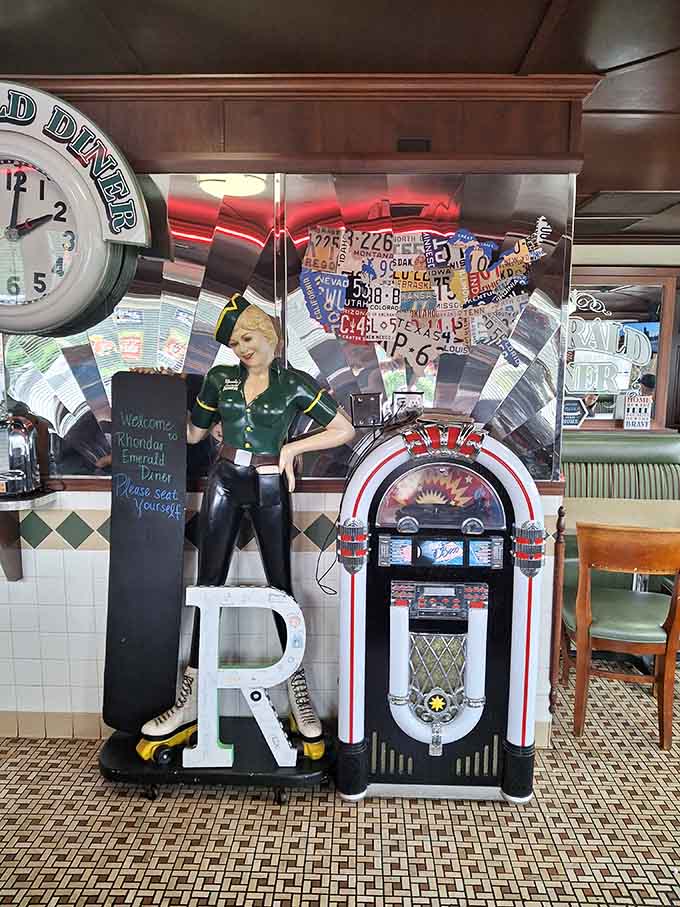 That life-sized carhop and classic jukebox aren't just decorations, they're your dining companions in this perfectly preserved time capsule.
