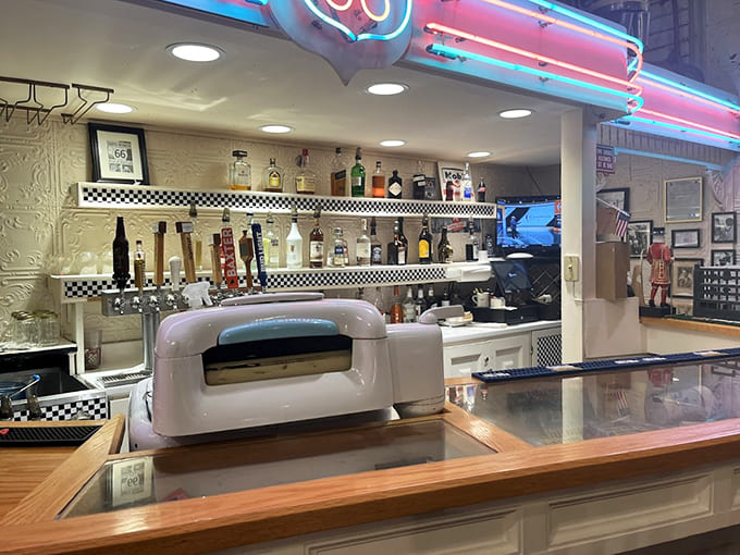 The bar area gleams with chrome and nostalgia, ready to serve up drinks that complement your trip down memory lane.
