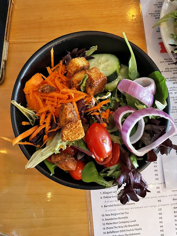 Who said salads are boring? This colorful creation is like a garden party in a bowl, with croutons playing the role of fun party guests.