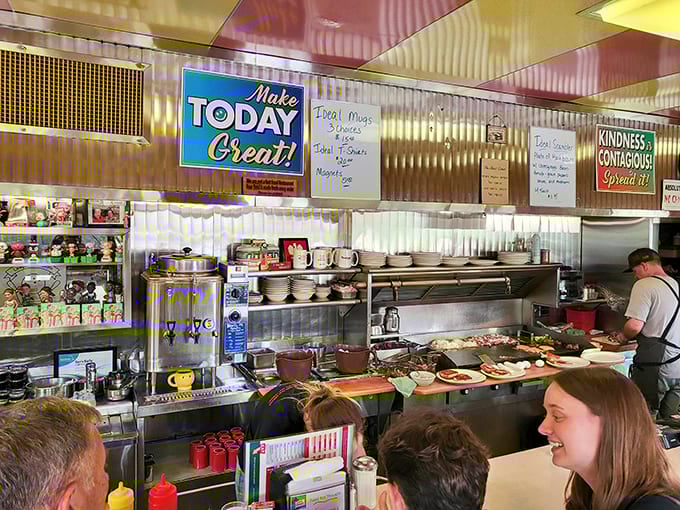 The open kitchen layout means transparency in action, where you can watch skilled hands transform simple ingredients into breakfast magic on that massive griddle.