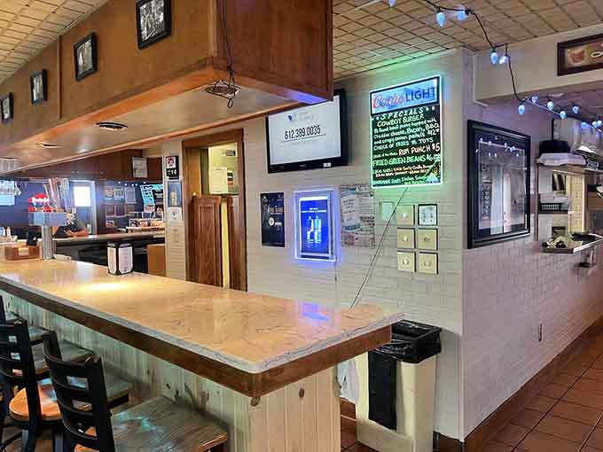 The counter area and bar provide front-row seats to watch the kitchen work its magic on that well-seasoned flat-top grill.