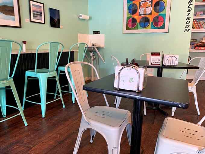 Mismatched chairs and intimate tables create a dining space that feels like your coolest friend's kitchen.