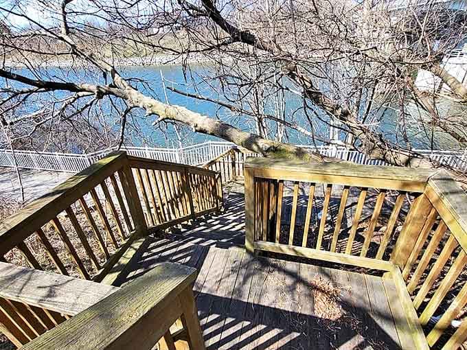 These wooden steps cascade toward the water like a rustic welcome, inviting visitors to discover hidden river views below.