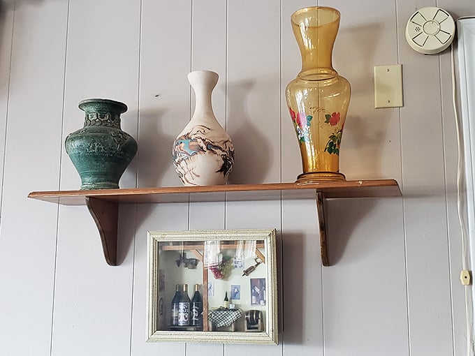 Vintage vases and thoughtful decorative touches create warmth and character that no hired designer could ever authentically replicate.